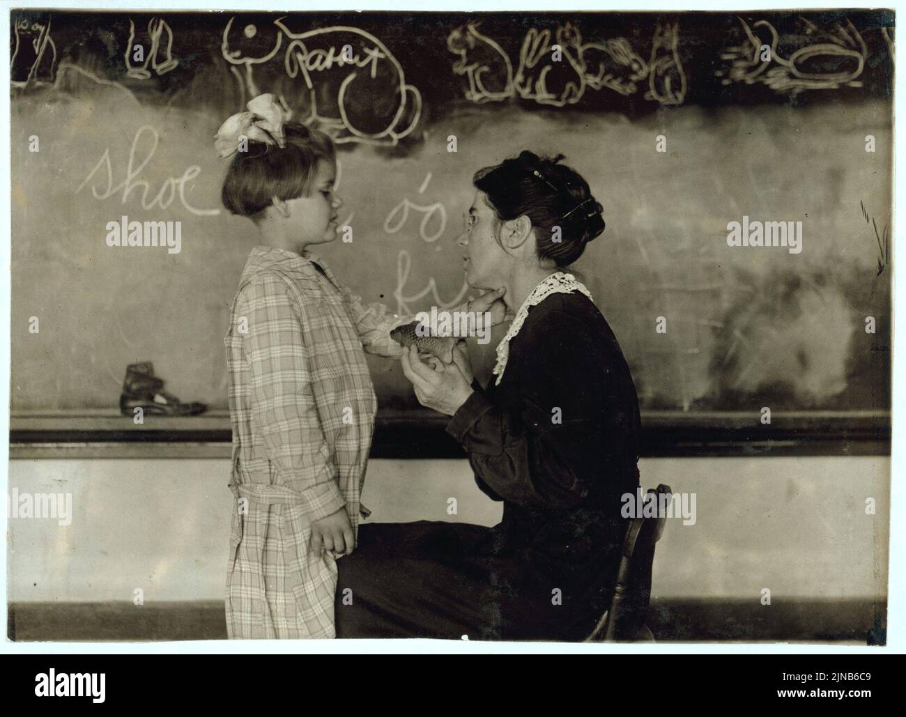 Teaching a deaf-mute to talk. Training School for Deaf Mutes. See 4843 ...