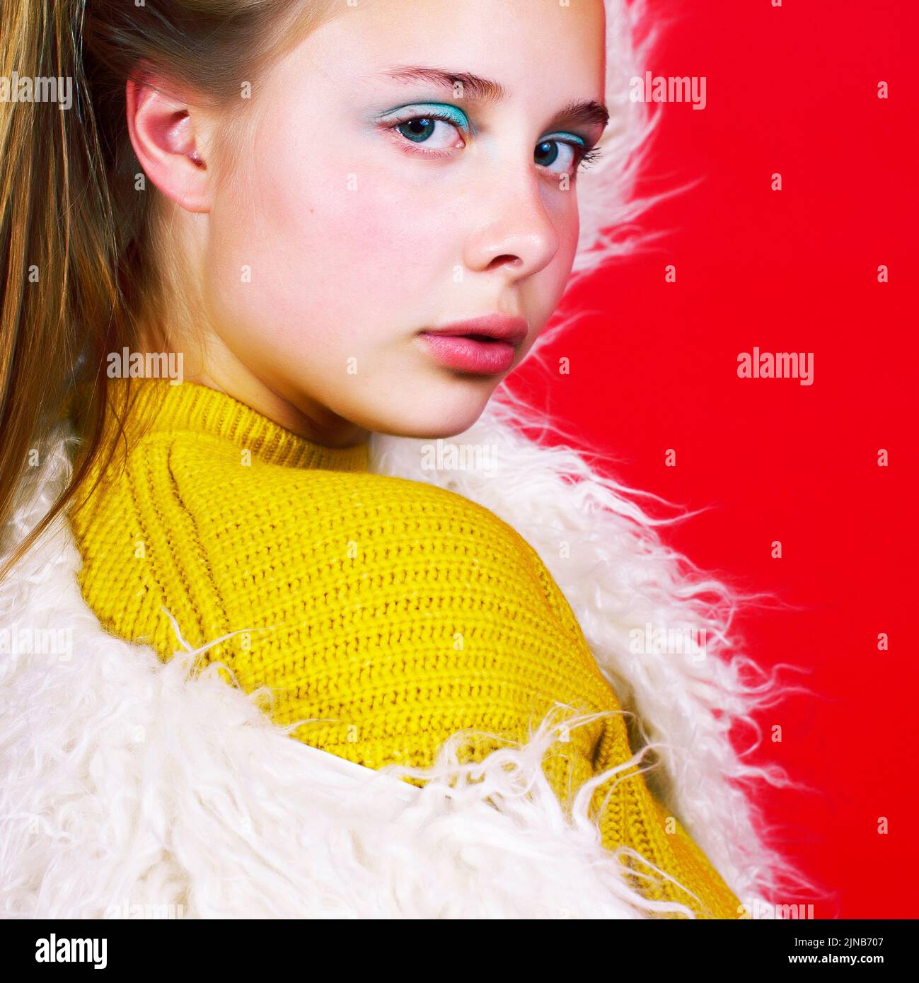 young pretty emitonal posing teenage girl on bright red background ...