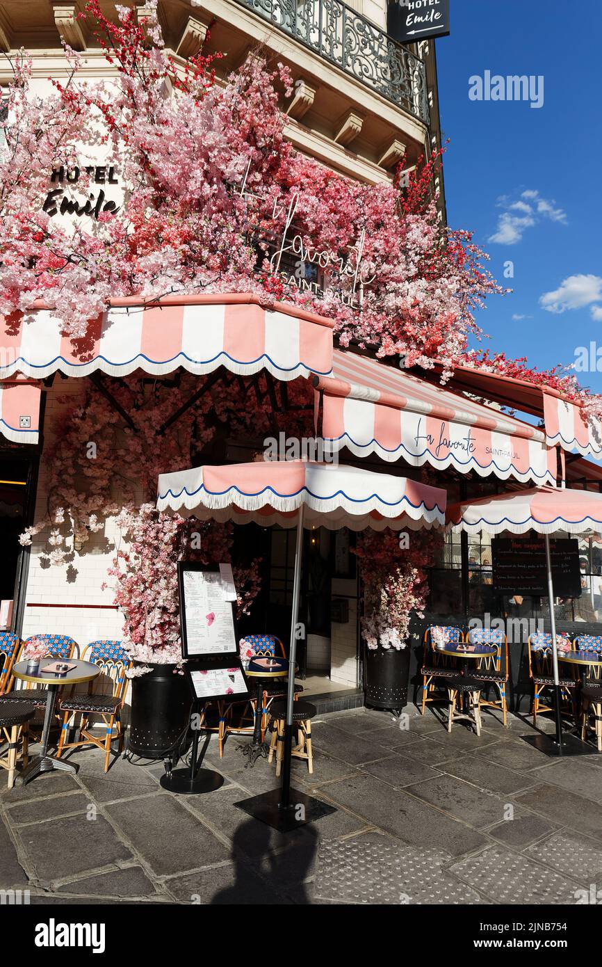 The traditional French cafe Favorite decorated with flowers . It ...