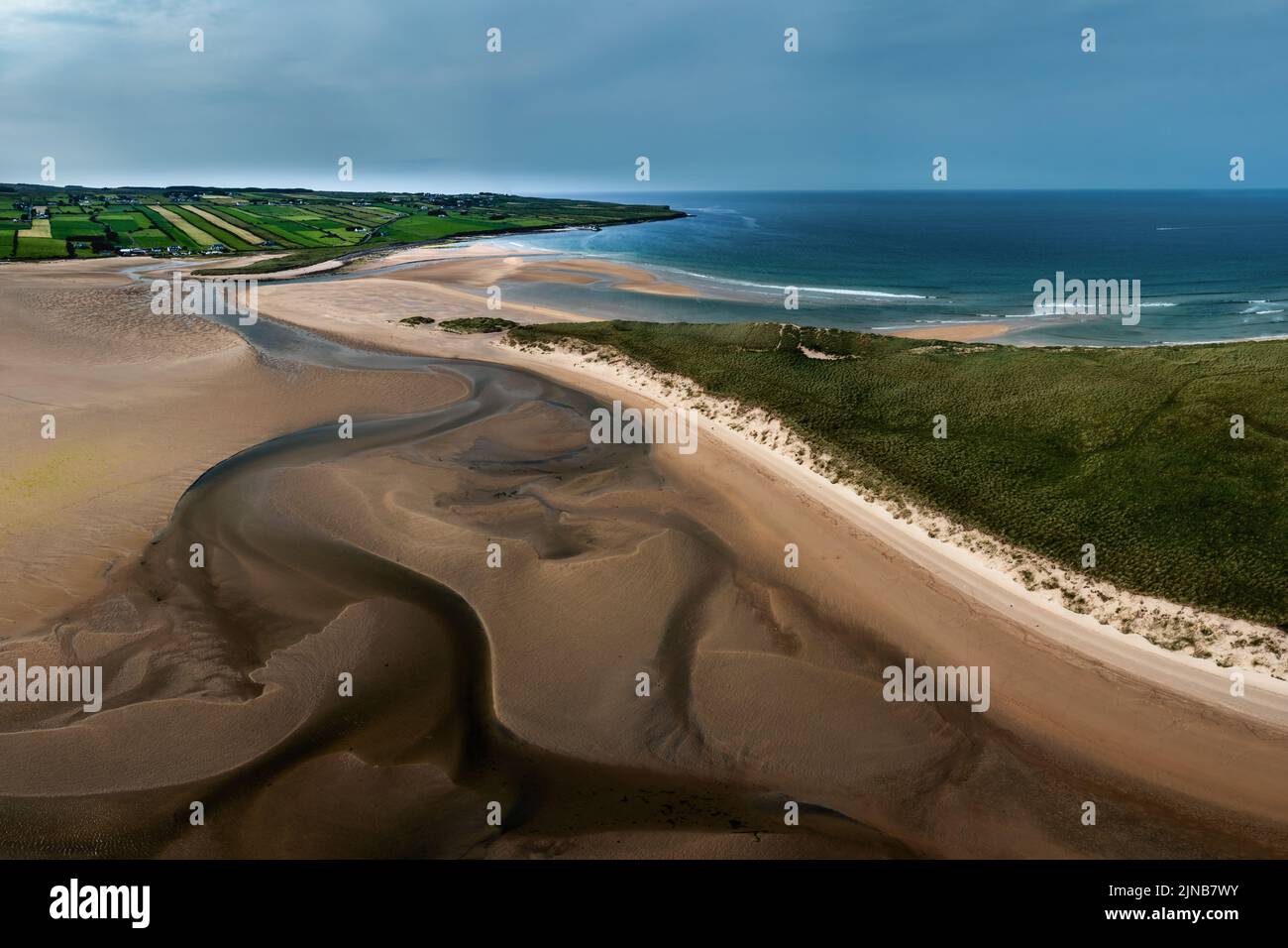 A panorama drone landscape view of the beautiful golden sand beach at ...