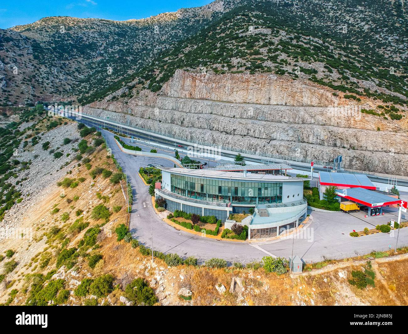 Aerial panoramic view over Moreas Motorway at Artemisio mount. A7 ...