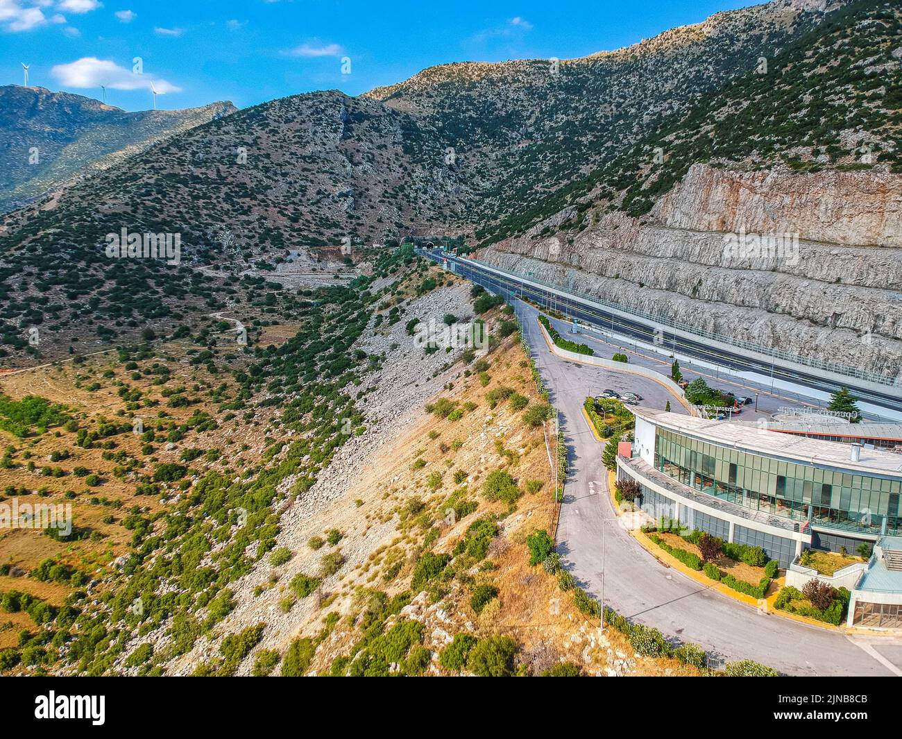 Aerial panoramic view over Moreas Motorway at Artemisio mount. A7 ...