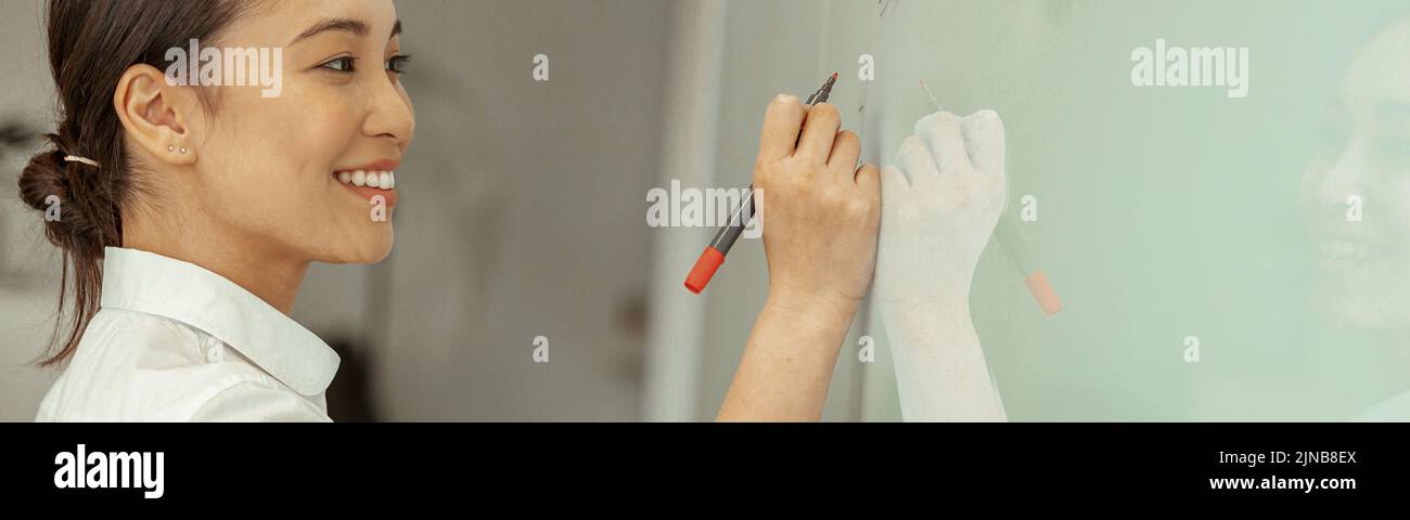 Smart asian business woman write project plan on flipboard during ...