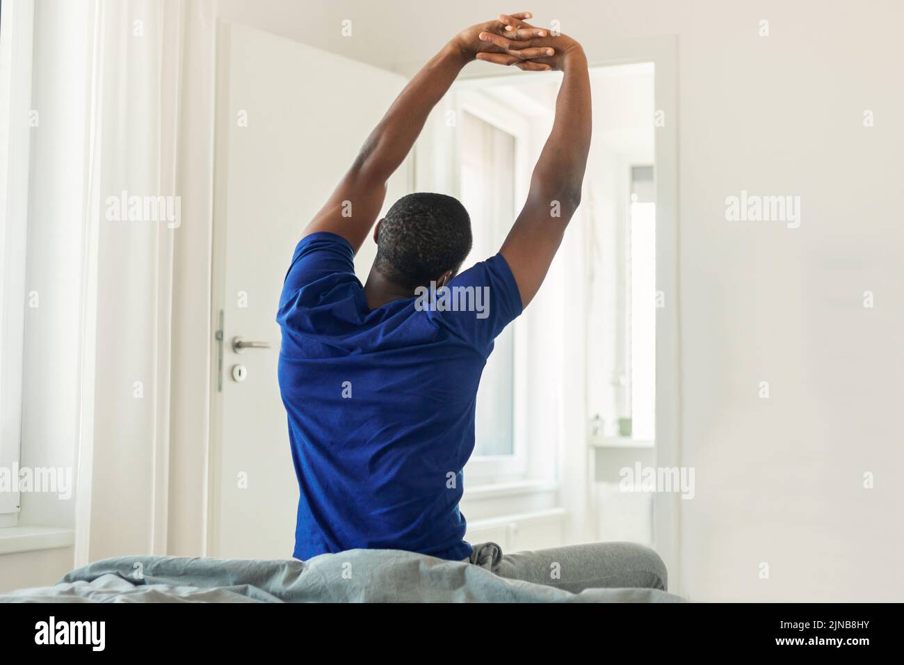 Man stretching arms african hi-res stock photography and images - Alamy