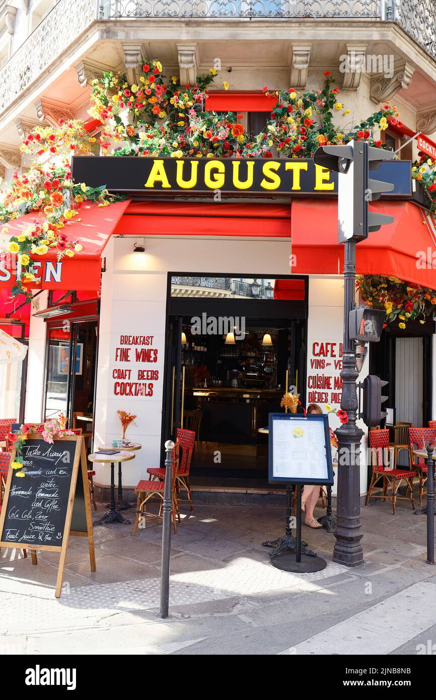 The traditional French cafe Auguste decorated with flowers . It located ...