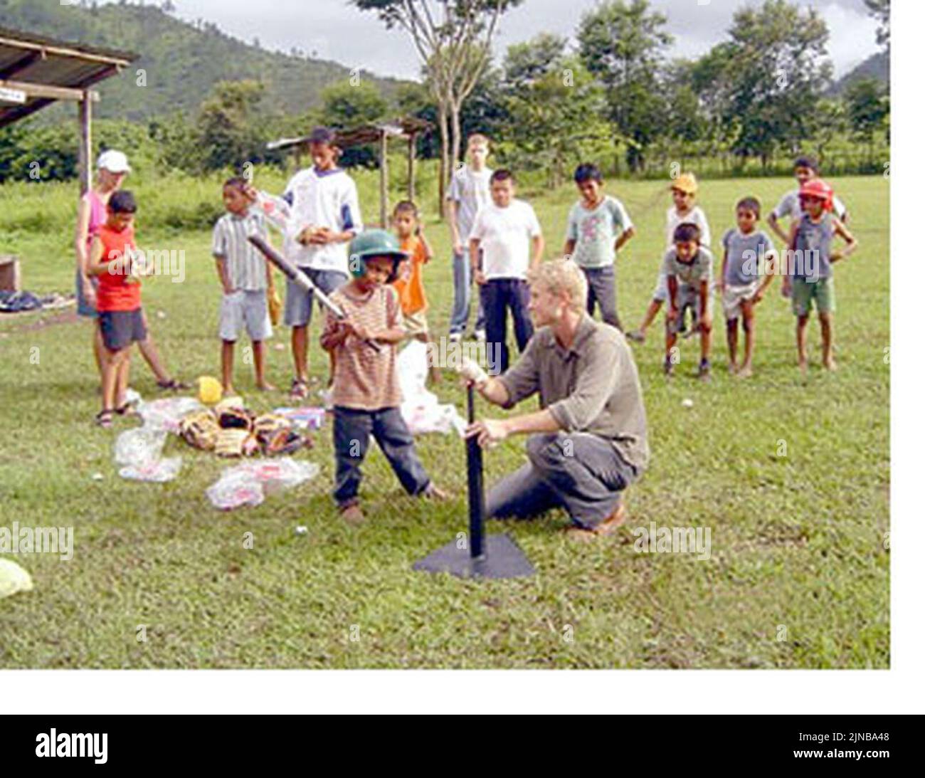 Tee-ball wity Peace Corps volunteer, Honduras Stock Photo - Alamy