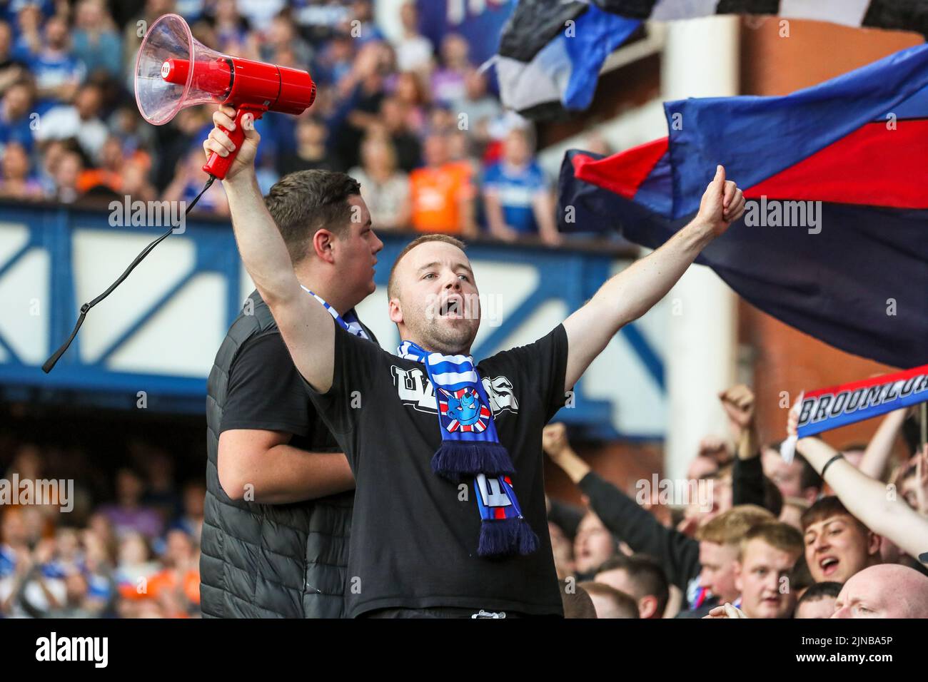 A supporter of Rangers FC football club co-ordinating the chanting and ...