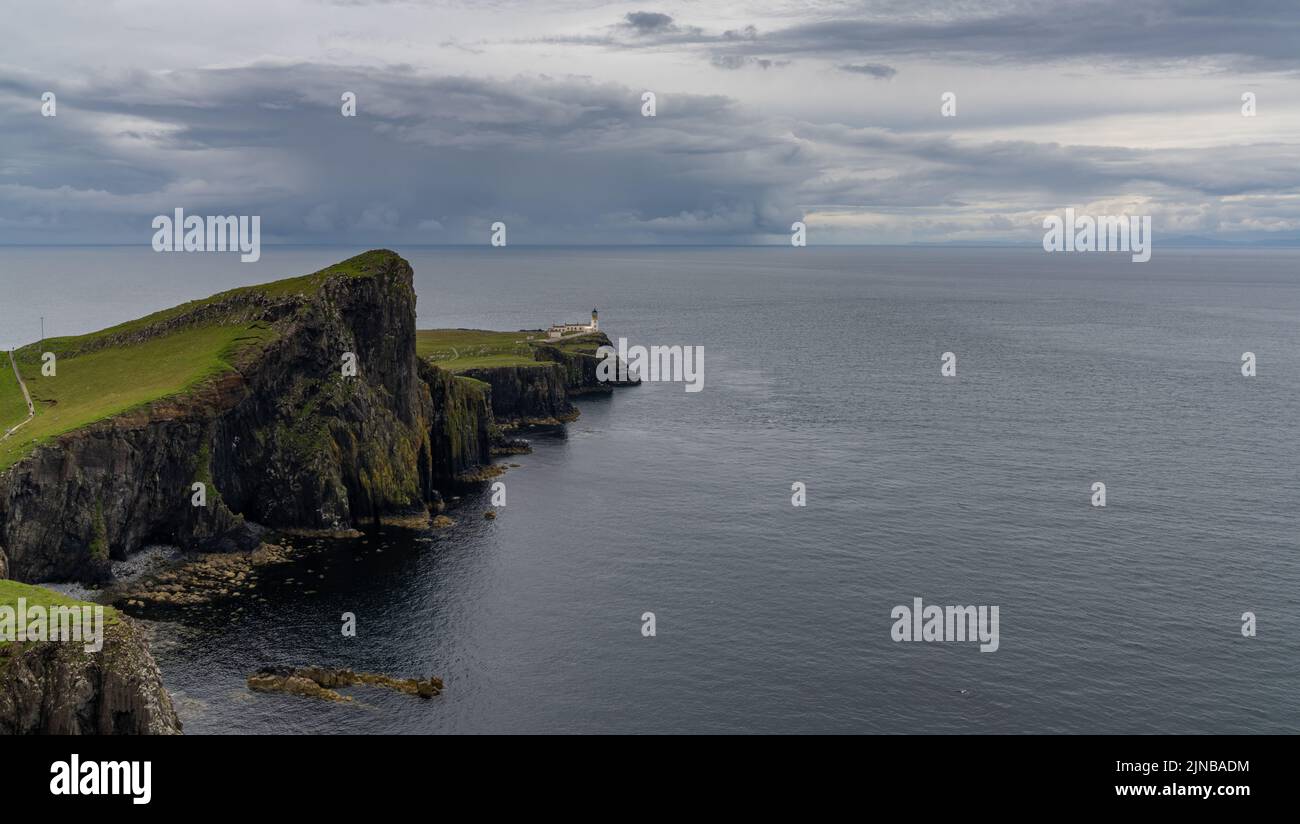 A view of the Neist Point Lighthouse on the green cliffs of the Isle of ...