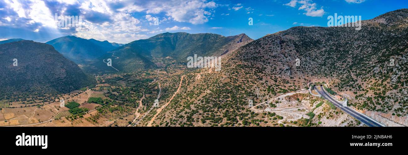 Aerial panoramic view over Moreas Motorway at Artemisio mount. A7 ...