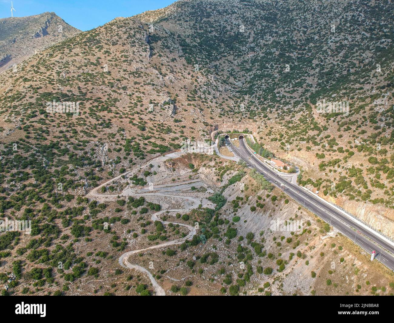 Aerial panoramic view over Moreas Motorway at Artemisio mount. A7 ...