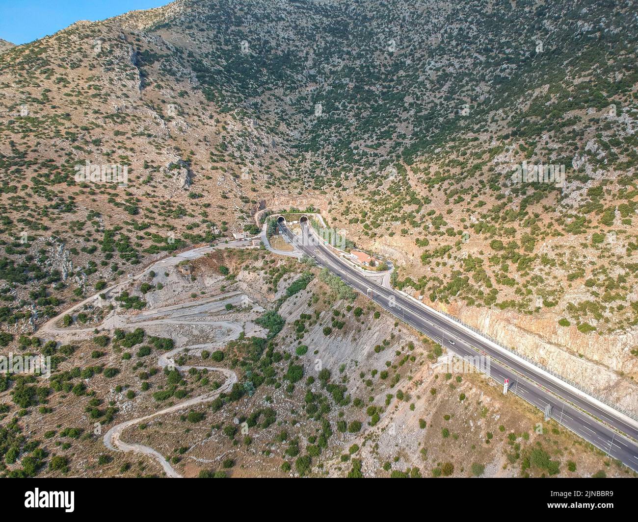 Aerial panoramic view over Moreas Motorway at Artemisio mount. A7 ...