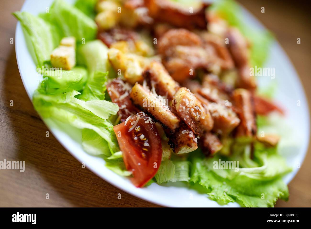 Fried octopus with cheese and lettuce Stock Photo - Alamy