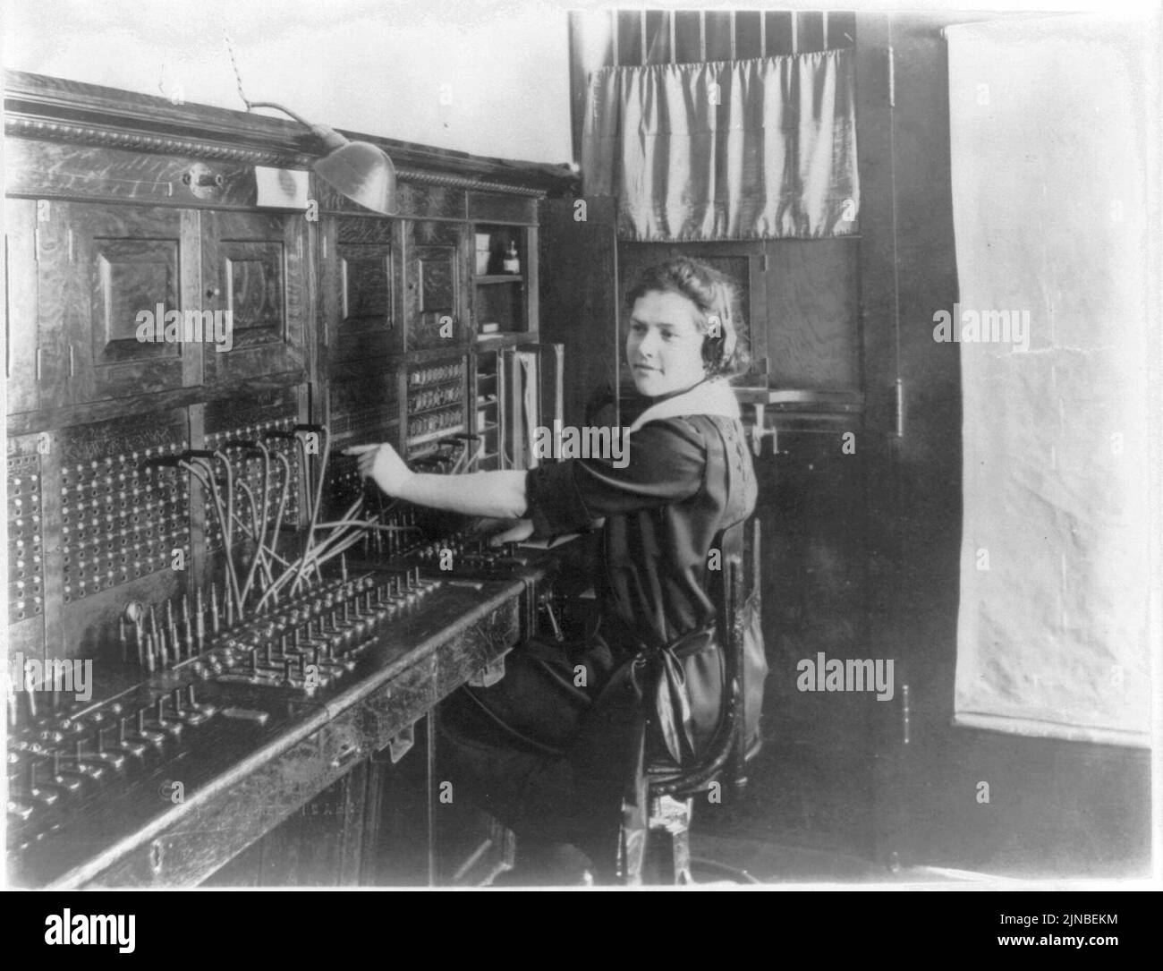 Telephone operator at work Stock Photo - Alamy
