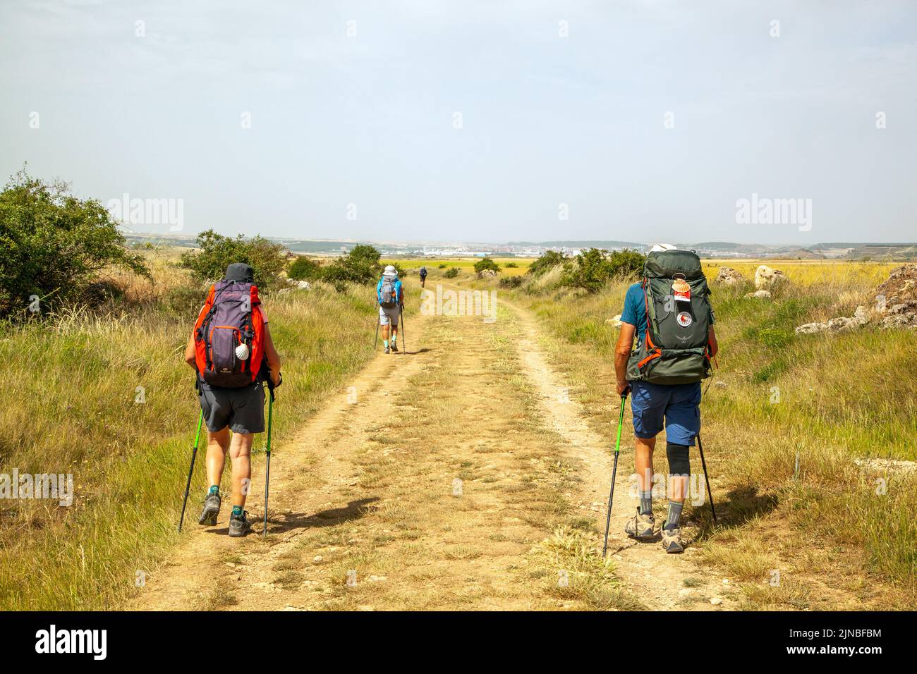 Pilgrims walking the Camino de Santiago pilgrimage route the way of St ...