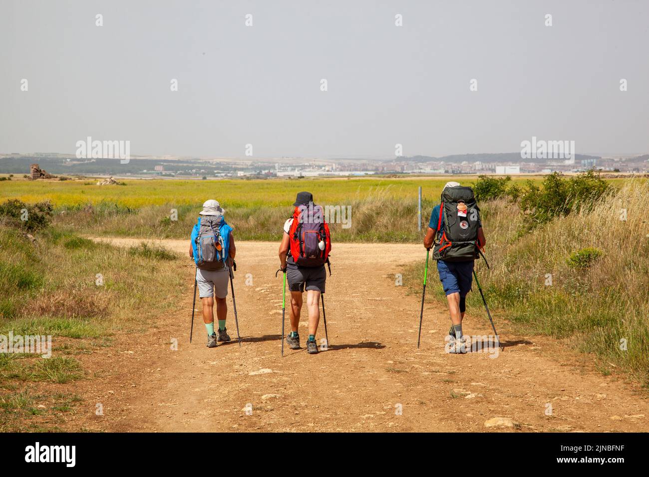 Pilgrims walking the Camino de Santiago pilgrimage route the way of St ...