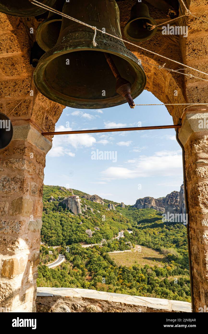 Old bell hanging on the tower overlooking the mountains through ...