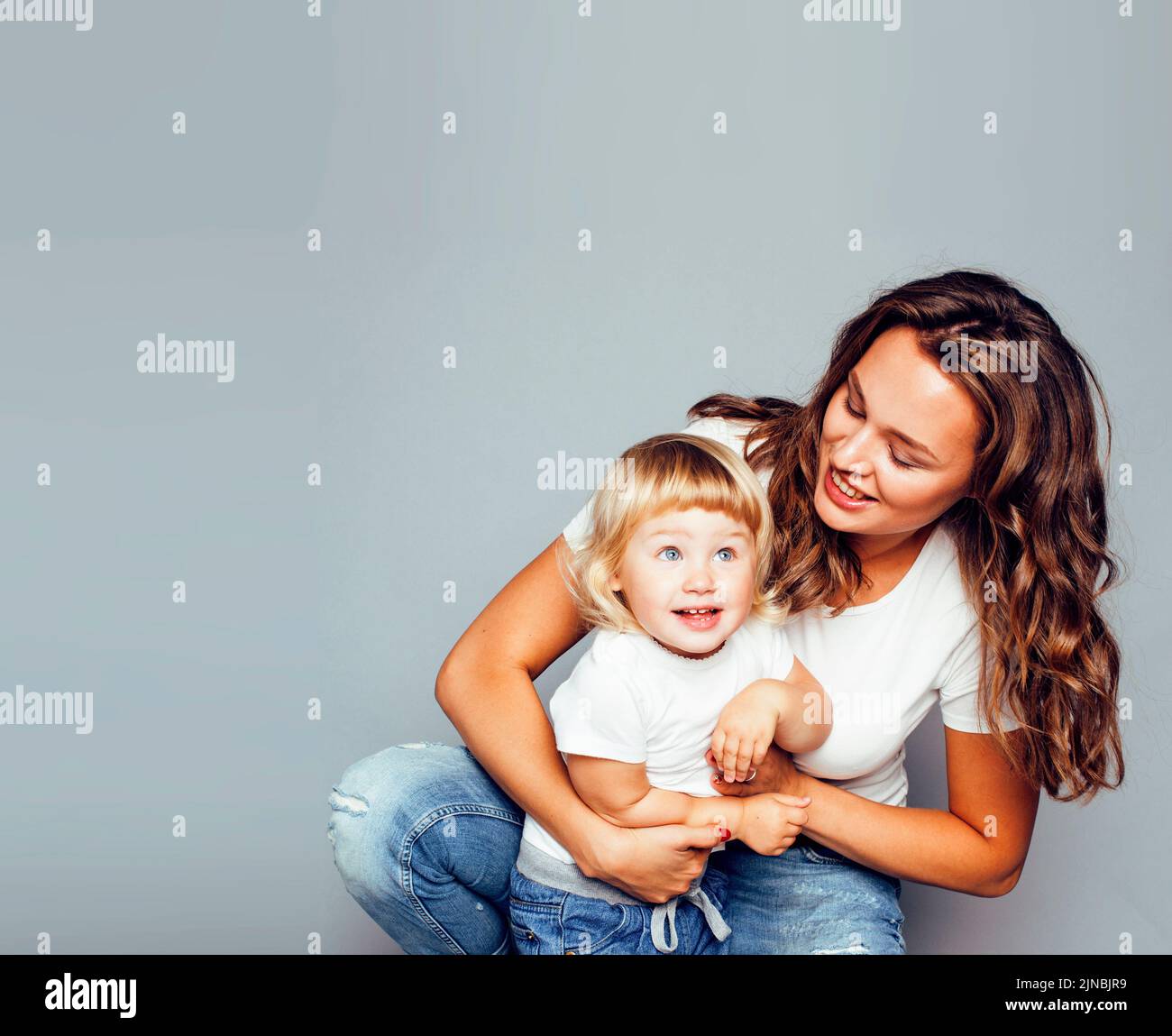bright picture of hugging mother and daughter happy together, smiling ...