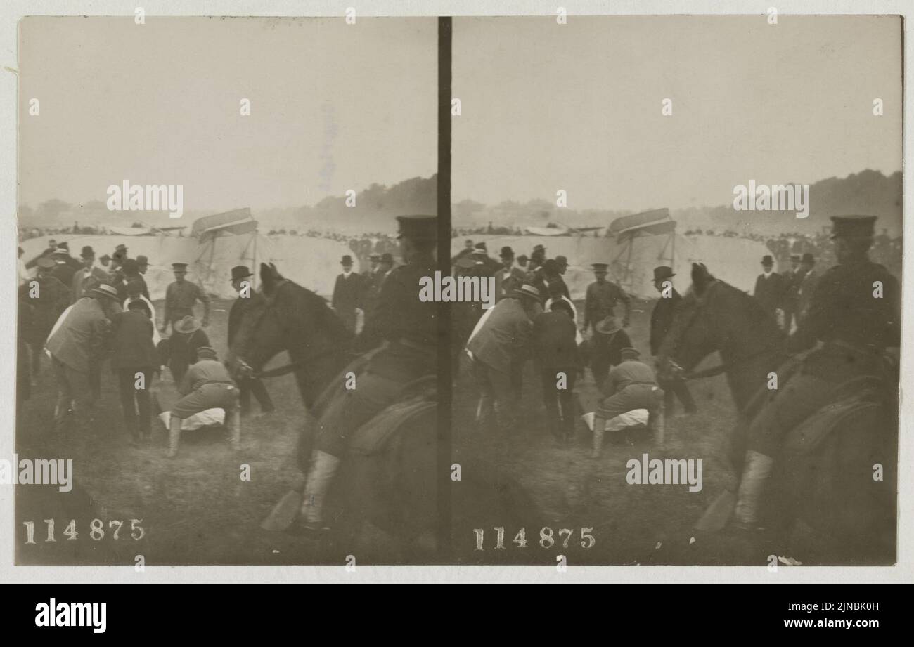 Tending to pilot Orville Wright or passenger Lieutenant Thomas E ...