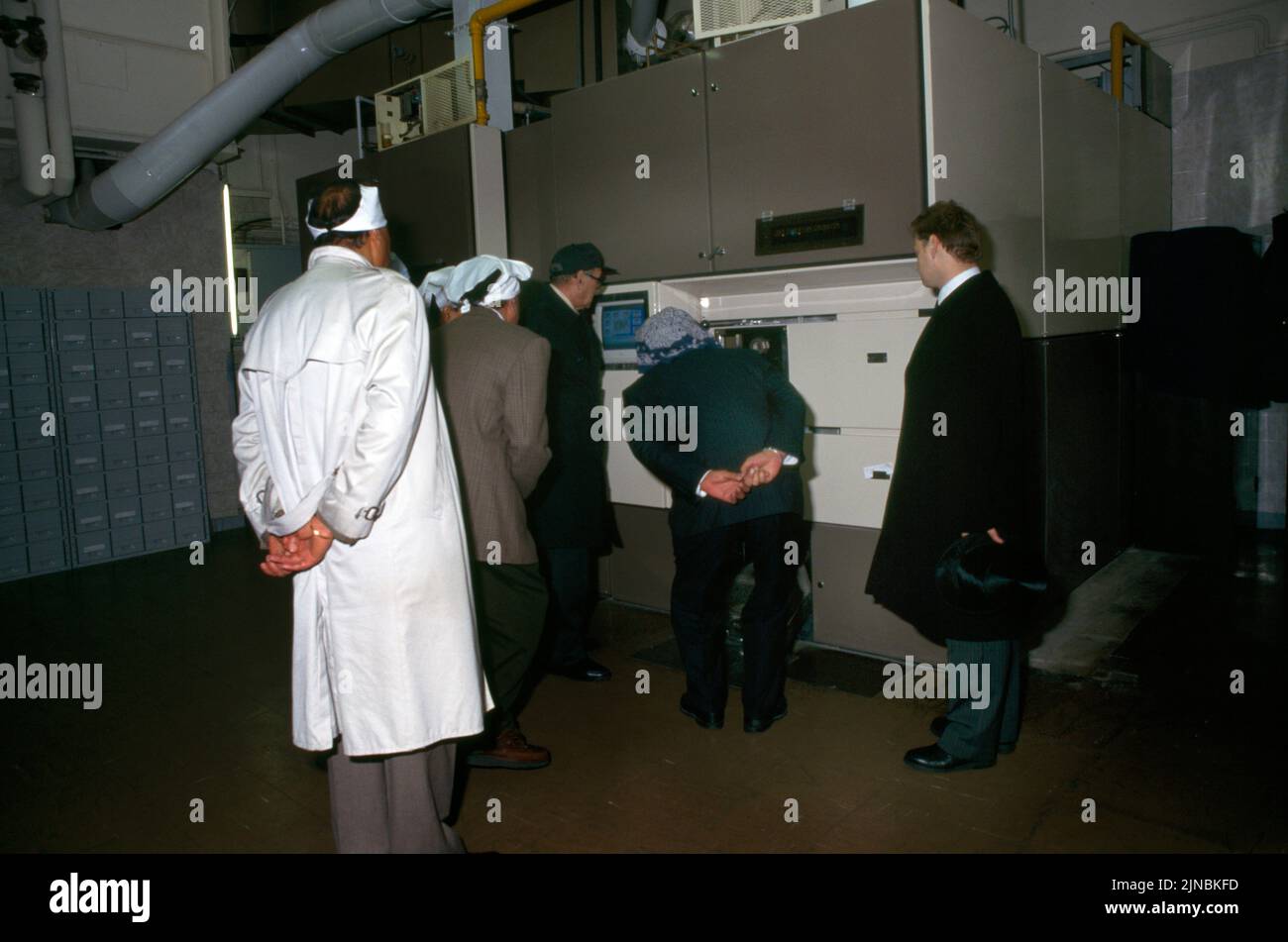 Sikh Men Watching Coffin In Furnace at a Crematorium Surrey England ...