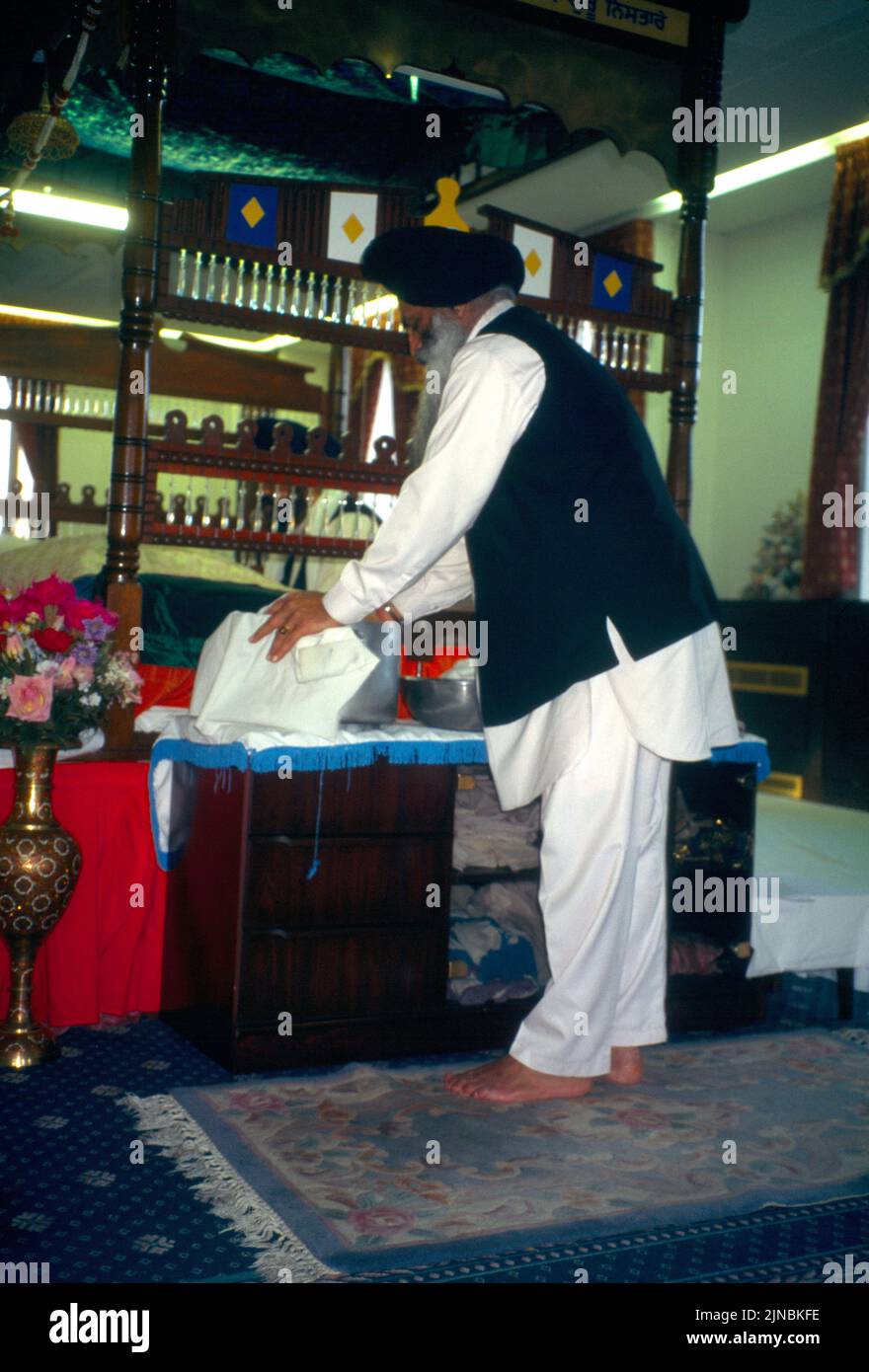 Sikh Man Bringing out Amrit after a Sikh Funeral London England Stock Photo - Alamy
