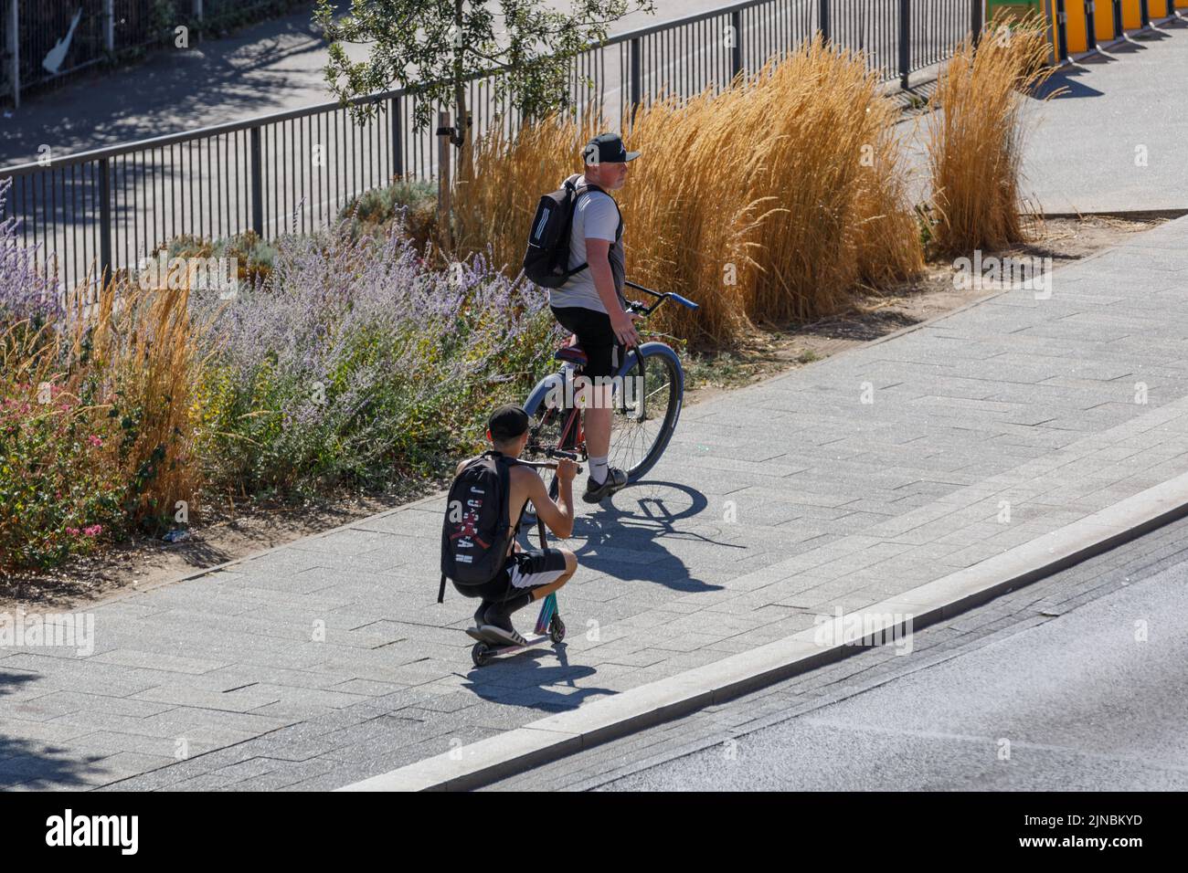 Boy with a bicycle wheel hi-res stock photography and images - Alamy