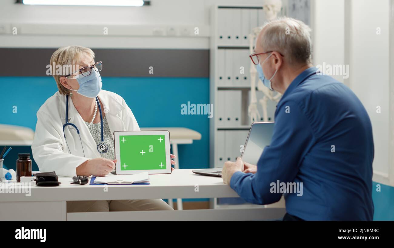 Physician holding horizontal greenscreen hi-res stock photography and ...