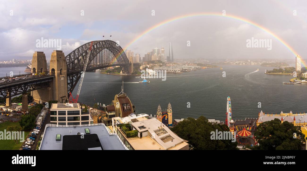 A beautiful, panoramic view of a rainbow over the Sydney Harbour Bridge ...