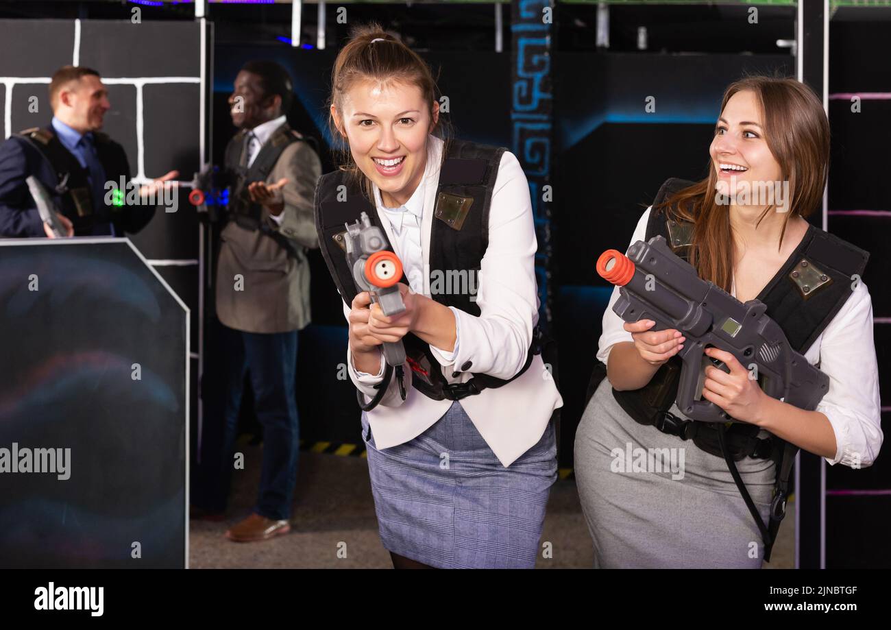 Two women having corporative entertainment Stock Photo - Alamy