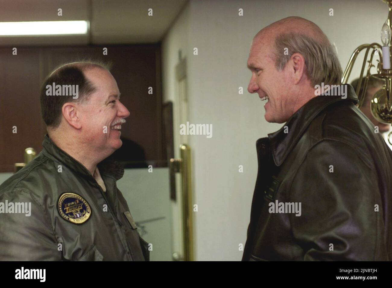Terry Bradshaw shares a laugh with Capt. David L. Logsdon Stock Photo ...