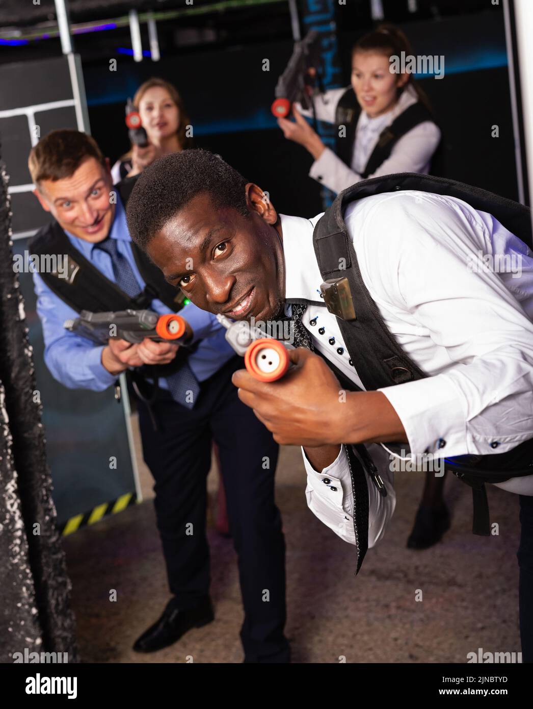 men and women co-workers having corporate entertainment Stock Photo - Alamy