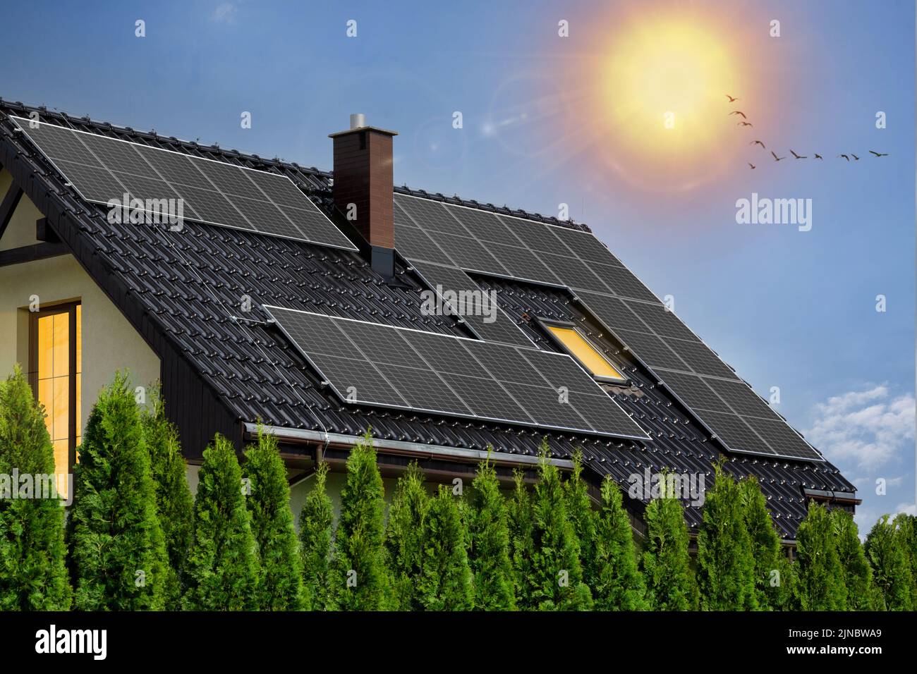 Modern house with black solar panels on roof. Photovoltaic panels on ...