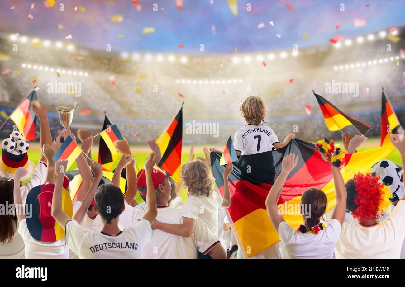 Germany football supporter on stadium. German fans on soccer pitch ...
