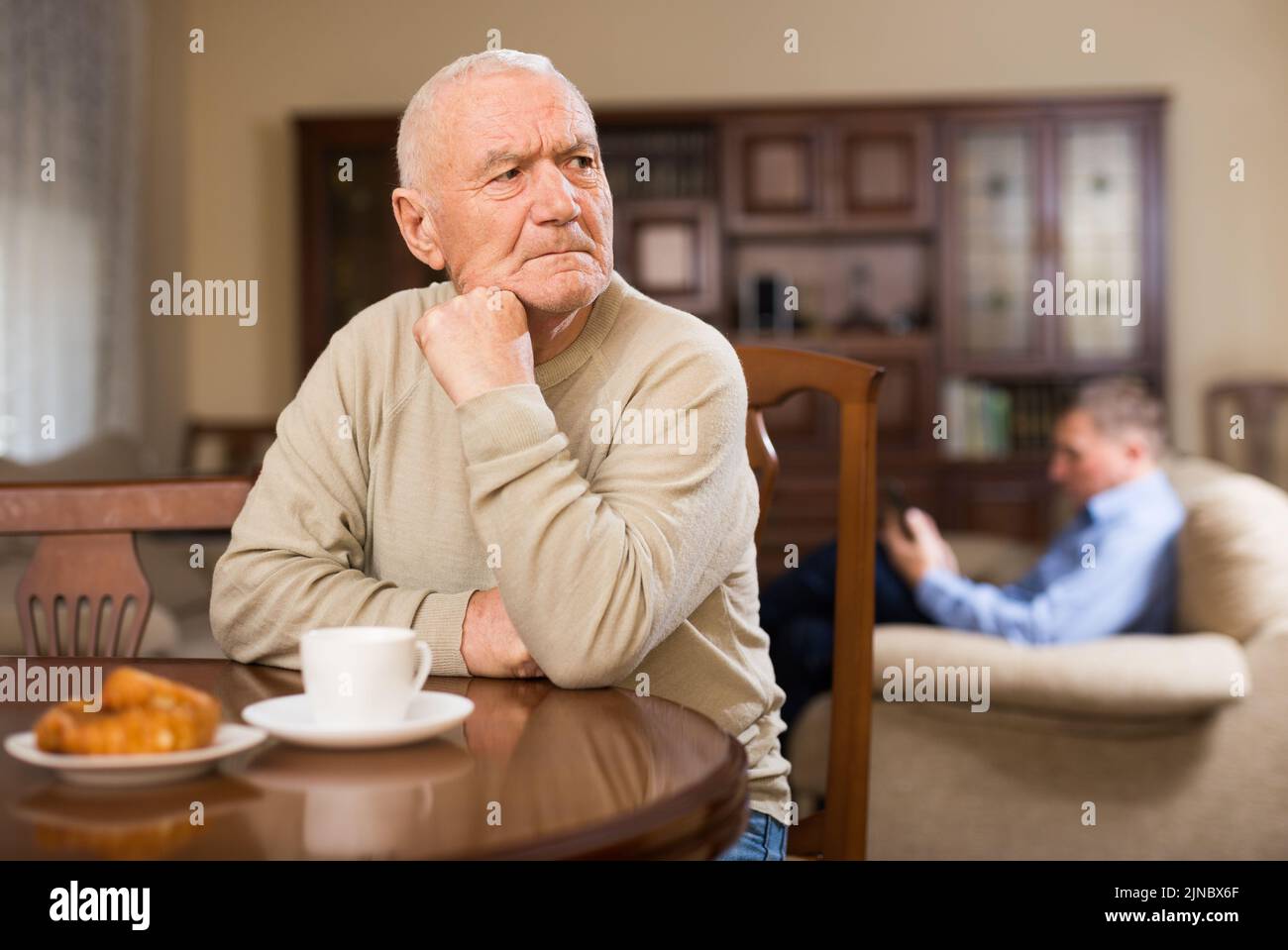 Adult son dissatisfied with his father Stock Photo - Alamy