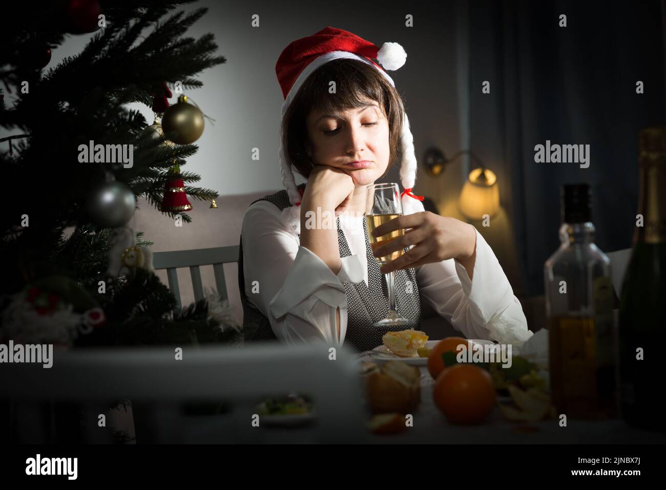 Sad girl celebrates New Year alone Stock Photo - Alamy