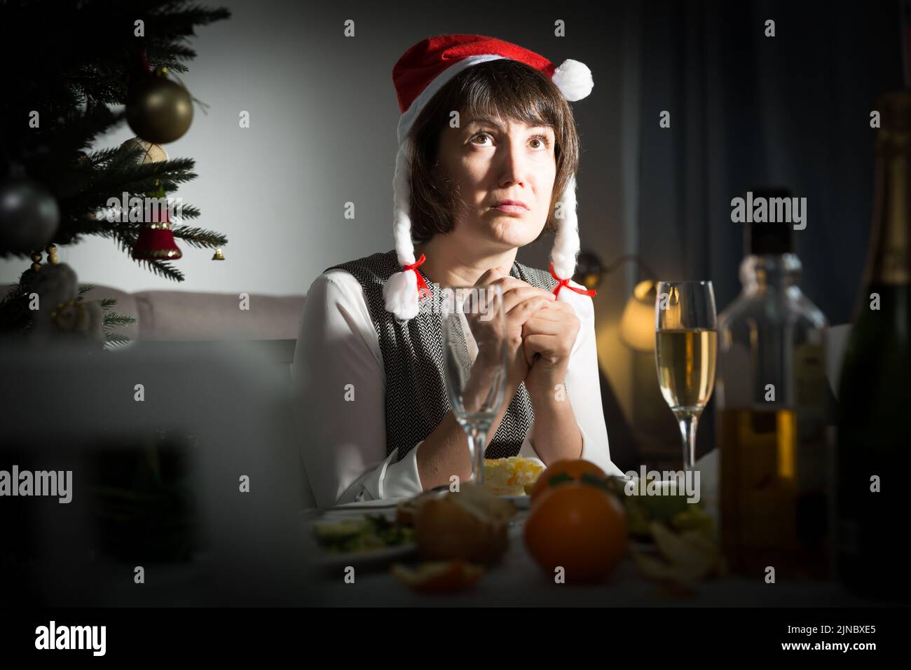 Sad girl celebrates New Year alone Stock Photo - Alamy