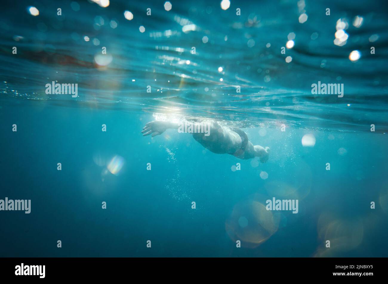Sporty man swims fast in the sea Stock Photo - Alamy