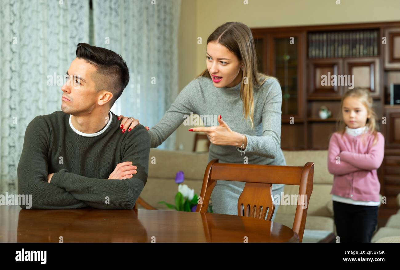 Woman scolding offended husband Stock Photo - Alamy