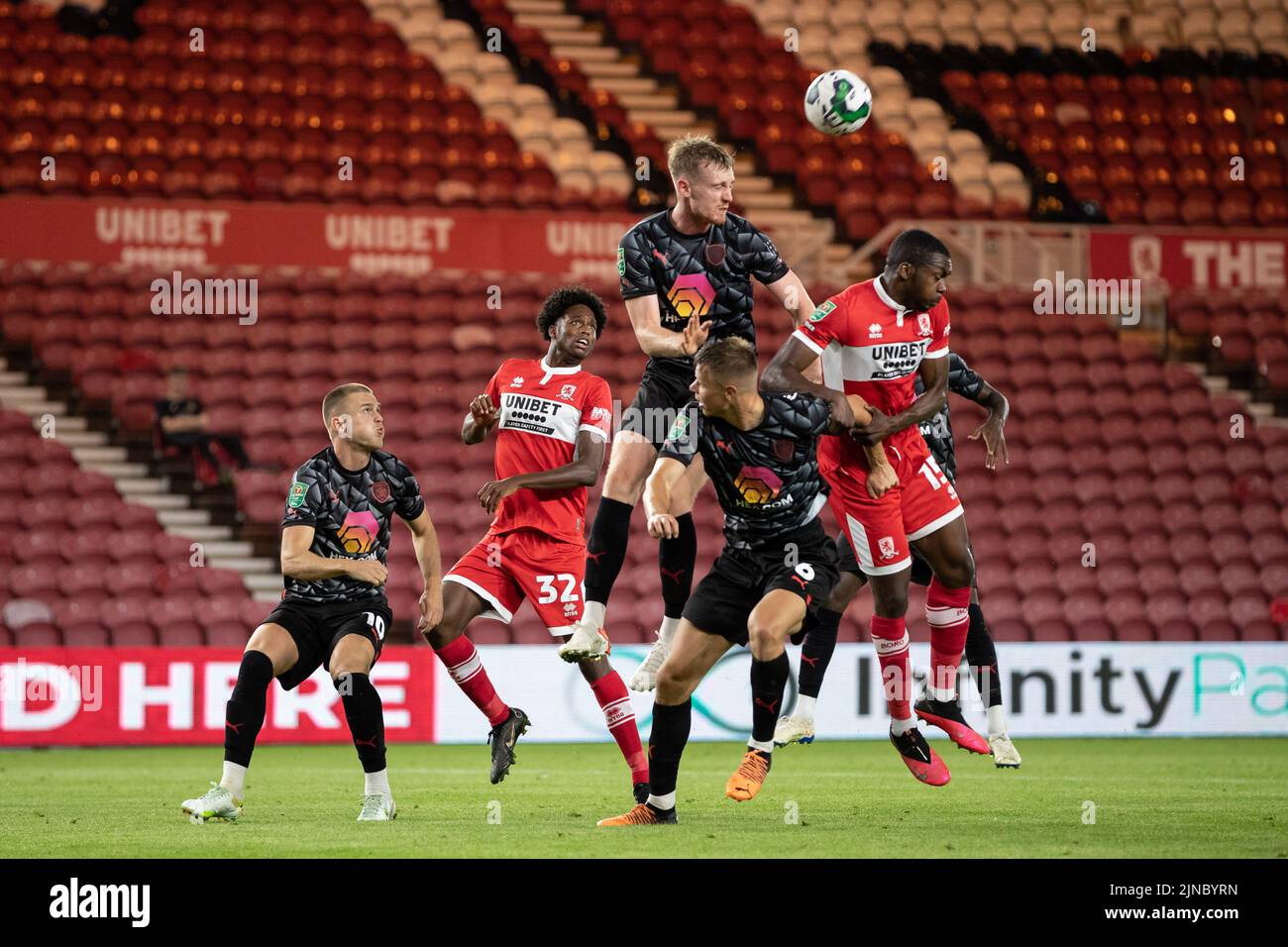Robbie Cundy #24 of Barnsley heads the ball from danger Stock Photo - Alamy