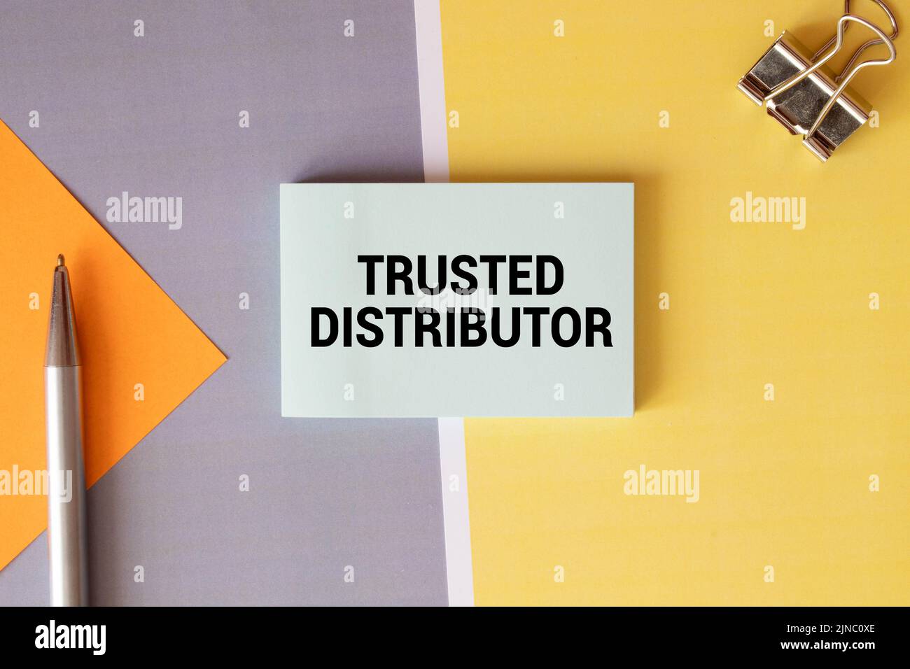 yellow paper with text Trusted Distributor on the white fridge Stock ...