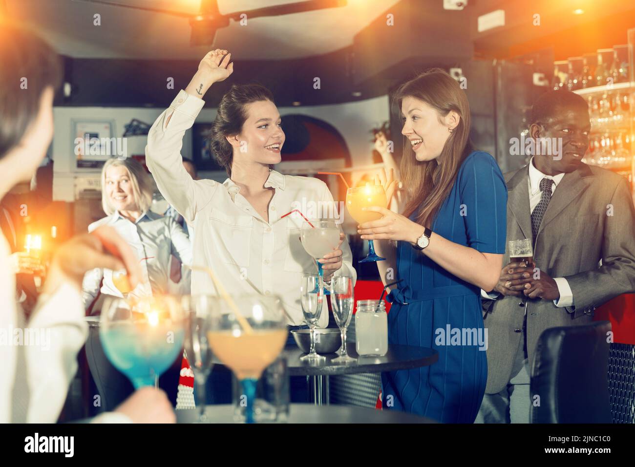 Young women having fun on office party Stock Photo - Alamy