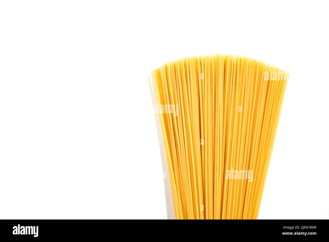 Italian food concept, bunch of raw long pasta, spaghetti, on white ...