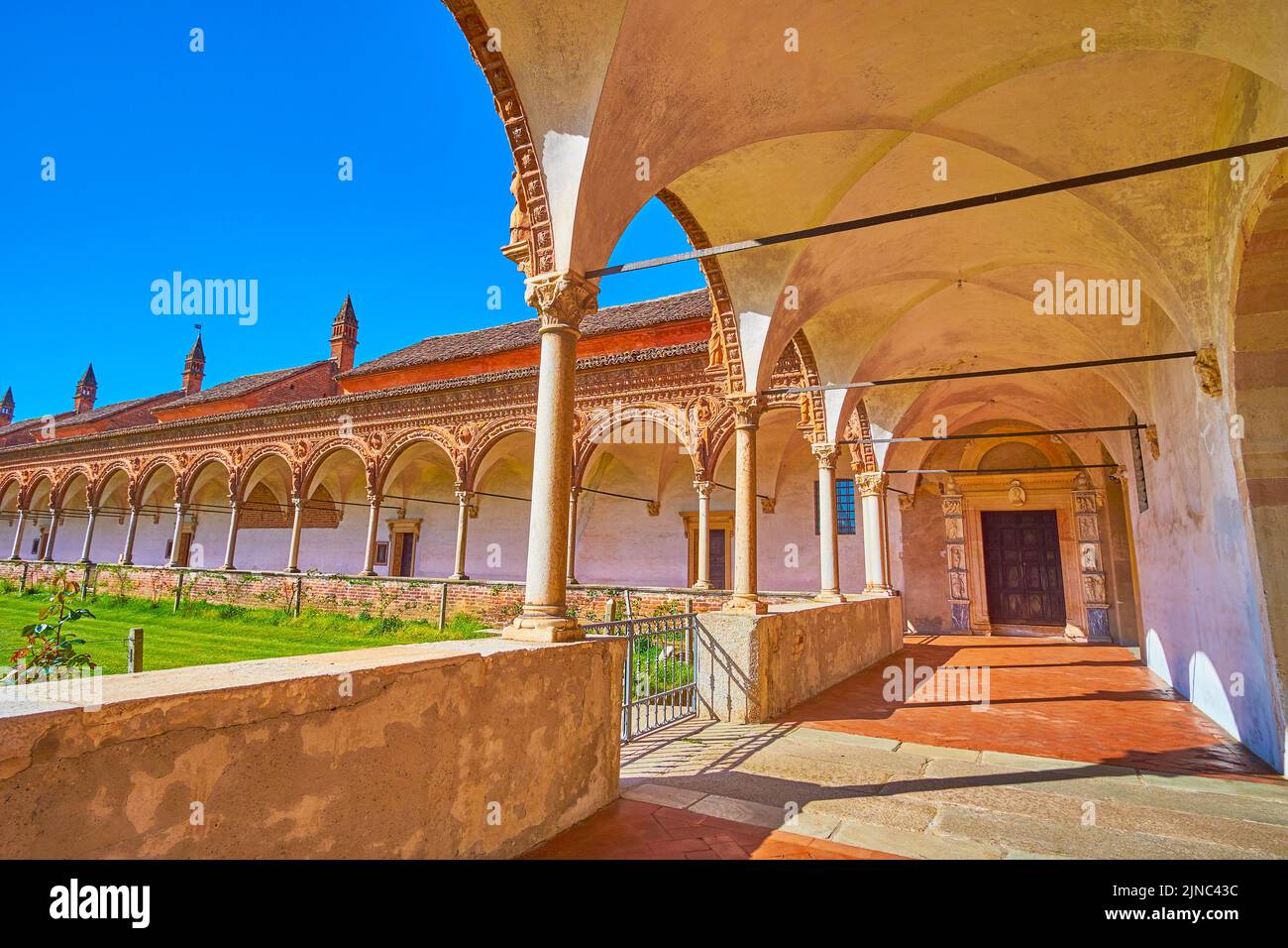 Walk along scenic medieval covered arched gallery of Grand Cloister in ...