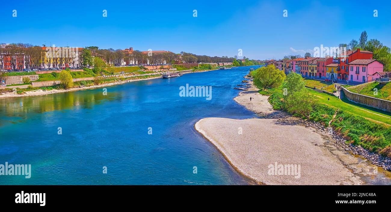 Panorama of narrow Ticino river and small residential houses on its ...