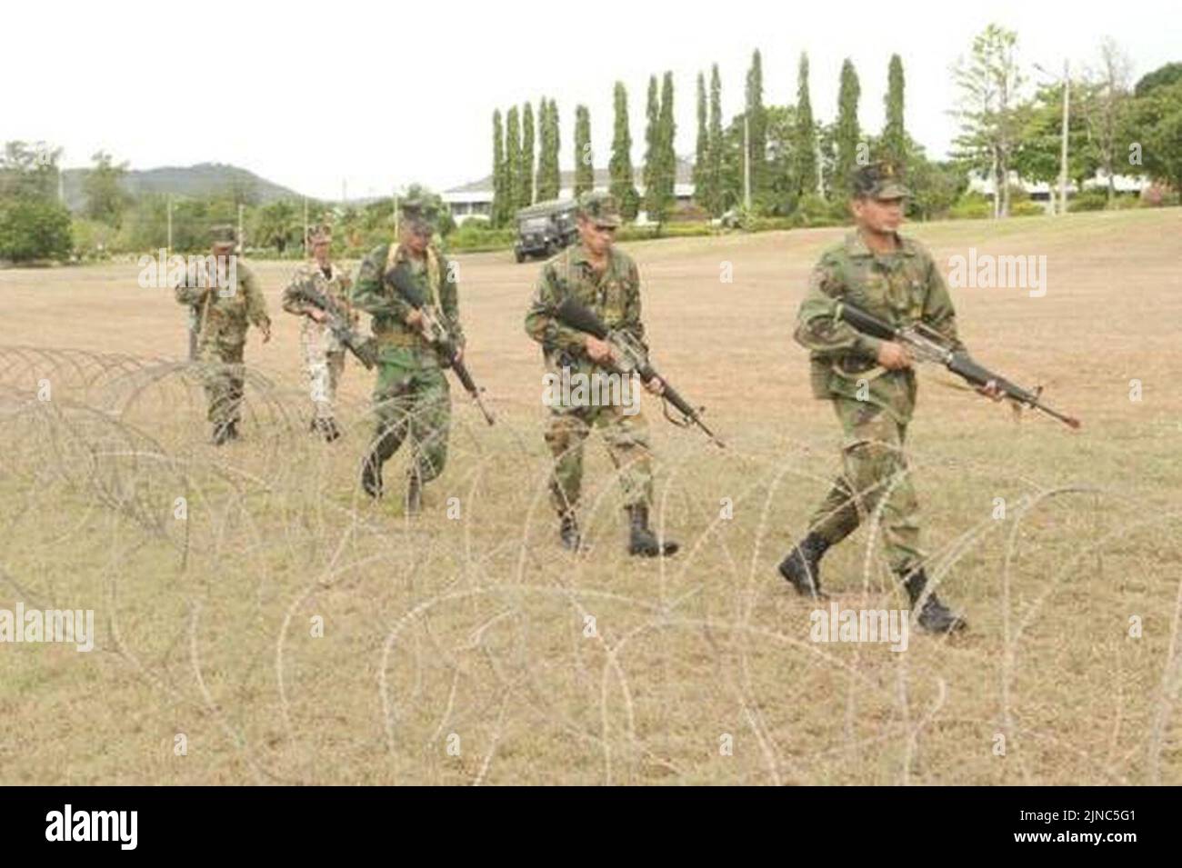 Thai marines walk alongside rows Stock Photo - Alamy