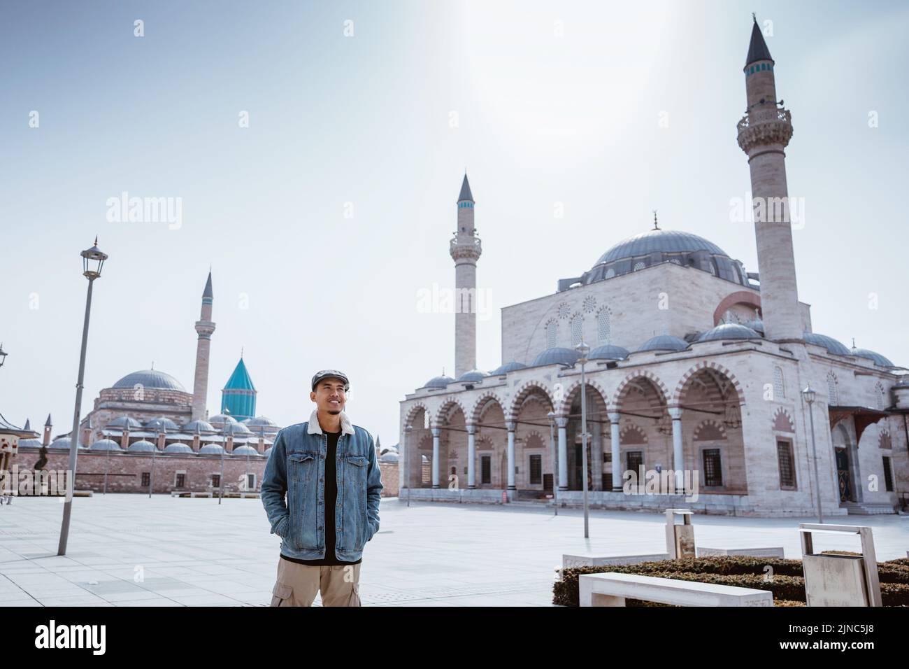 muslim young man standing in front of the mosque Stock Photo - Alamy