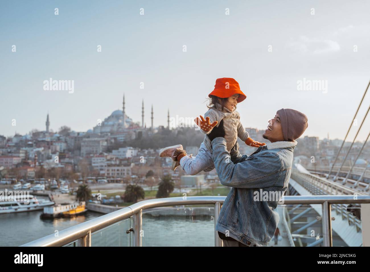 dad carrying his kid while enjoying istanbul turkey Stock Photo - Alamy