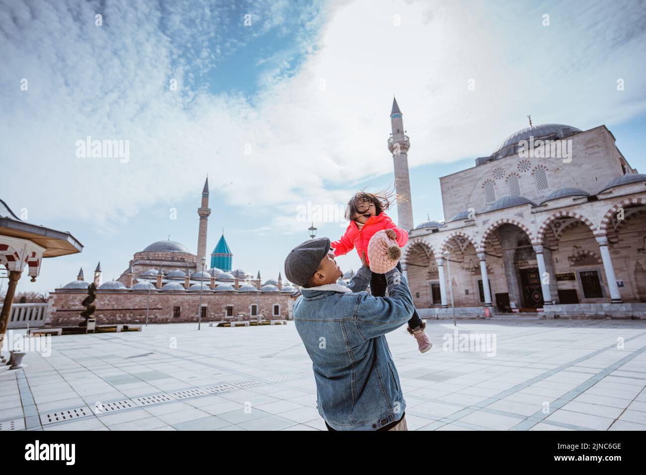 father and his little girl walking around the square in konya turkey ...