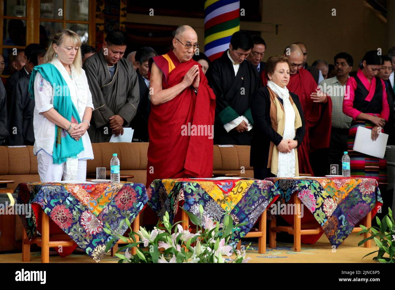 The 14th Dalai Lama praying in 2014 Stock Photo - Alamy