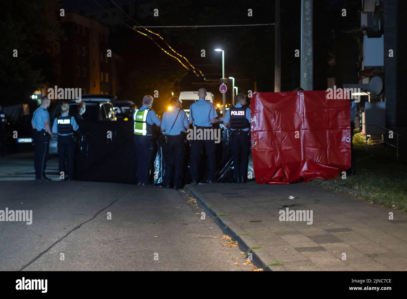 Solingen, Germany. 11th Aug, 2022. Police officers hold a visual screen ...