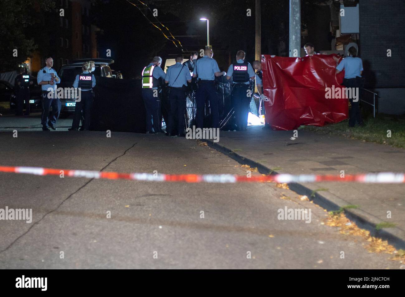 Solingen, Germany. 11th Aug, 2022. Police officers hold a visual screen ...